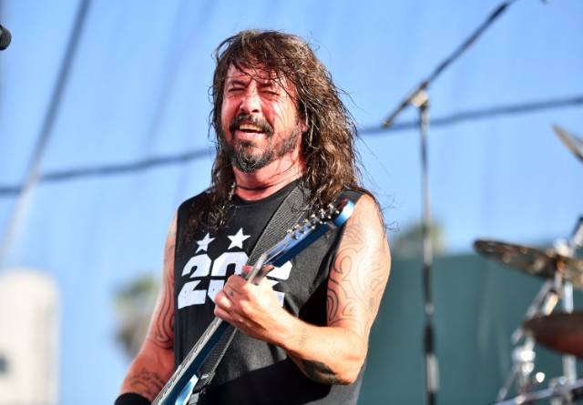 Watch Dave Grohl Fall Off The Stage In Vegas After Chugging A Beer